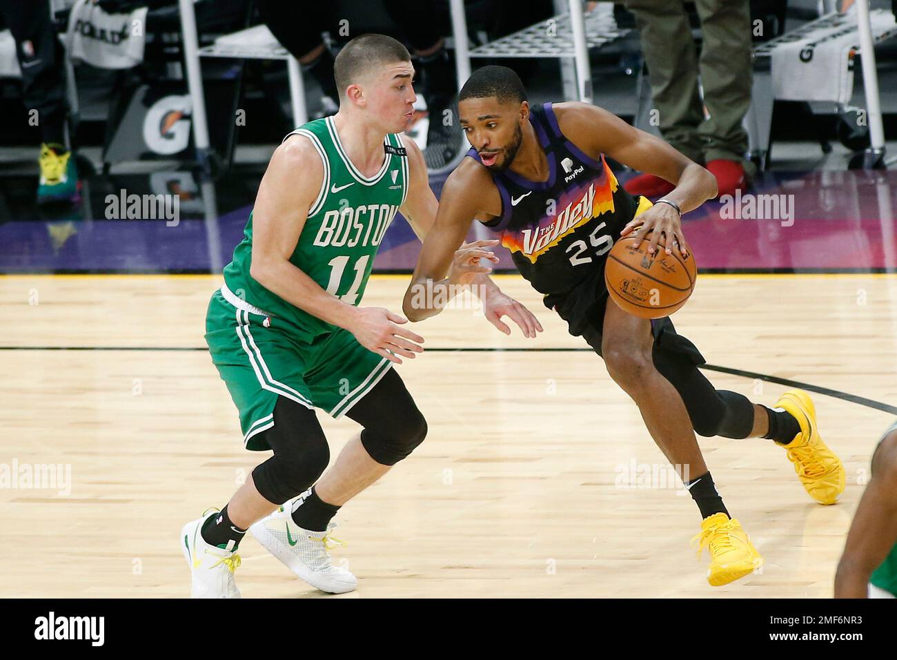 Phoenix Suns forward Mikal Bridges (25) drives to the basket as Boston ...