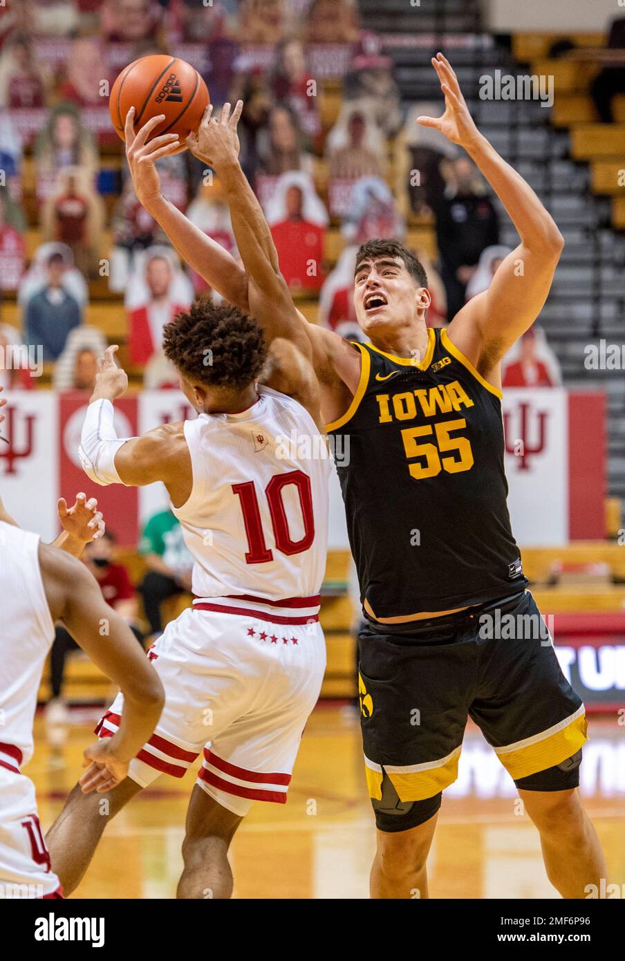Iowa center Luka Garza (55) battles for the ball with Indiana guard Rob ...