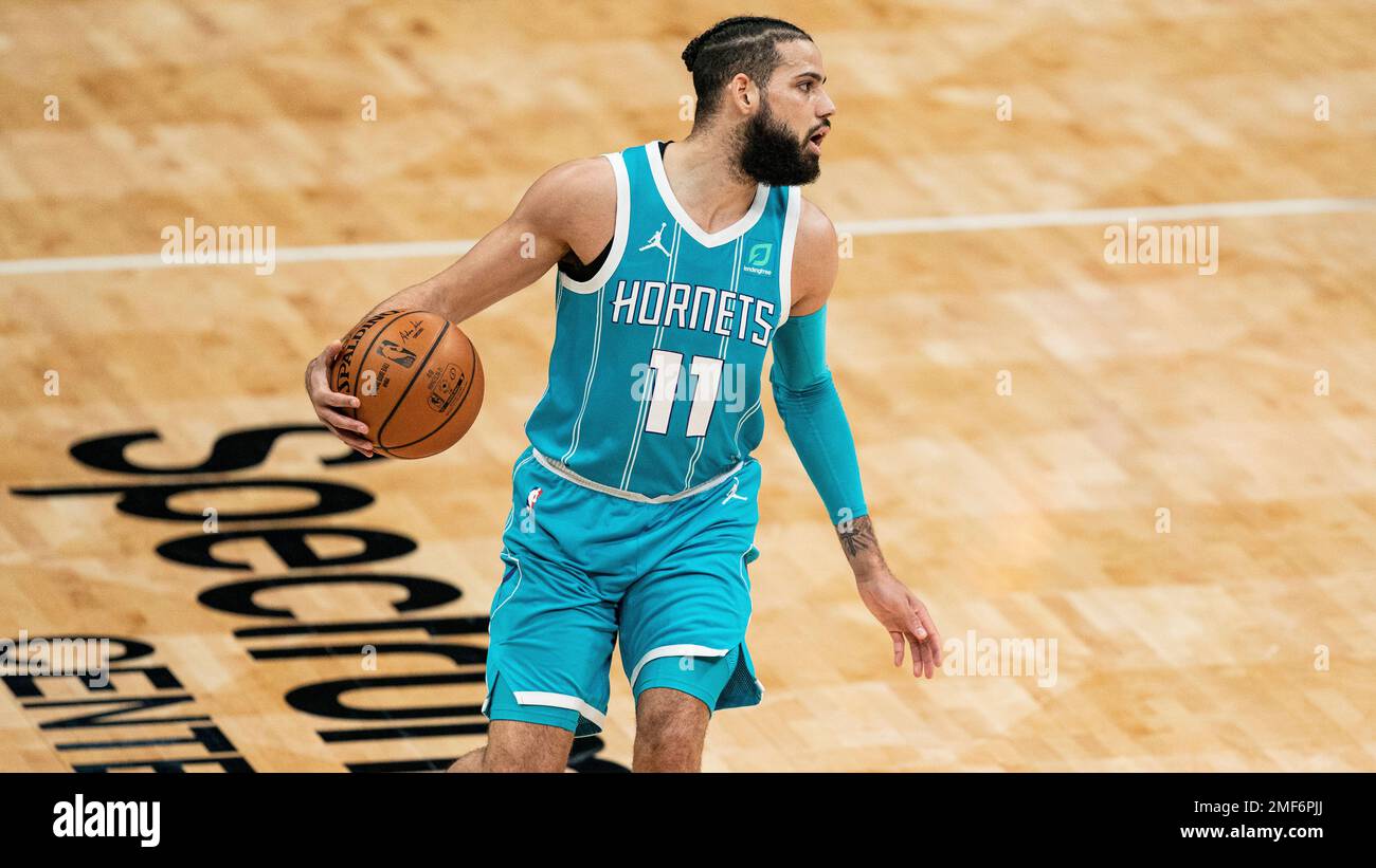 Charlotte Hornets forward Cody Martin (11) brings the ball up court ...