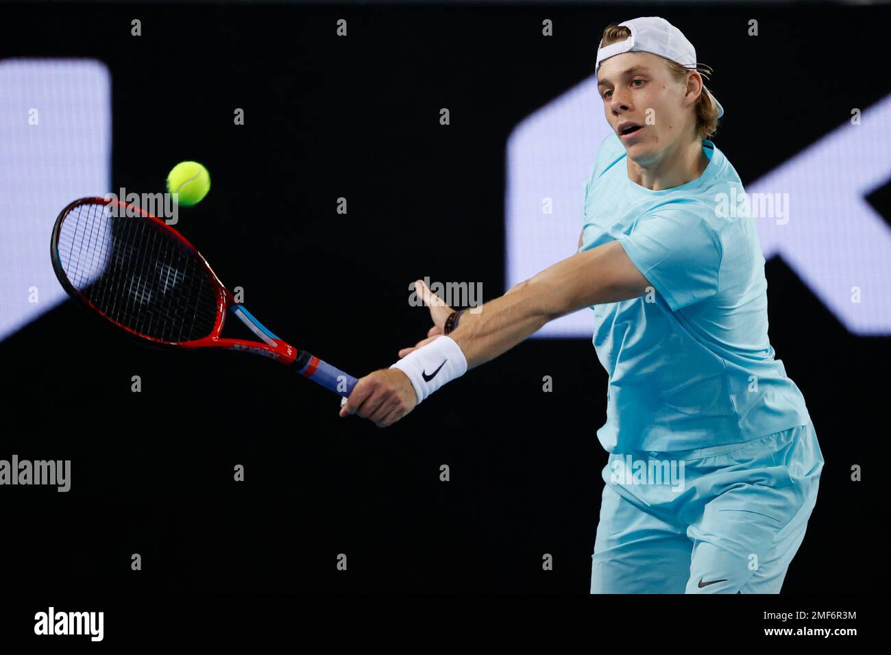 Canada's Denis Shapovalov makes a backhand return to Italy's Jannik Sinner at the Australian ...