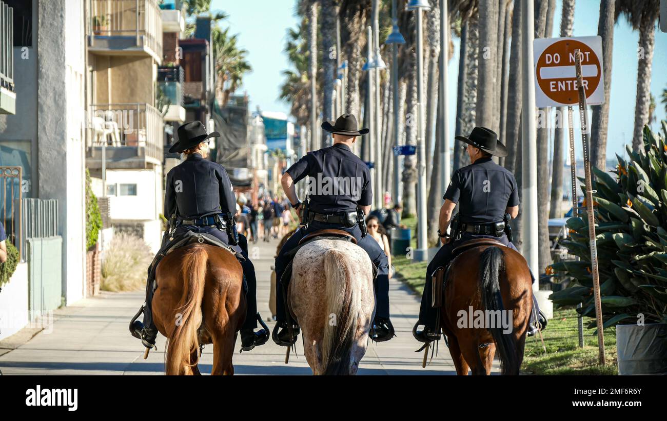 Police riding on horses through Venice Stock Photo - Alamy