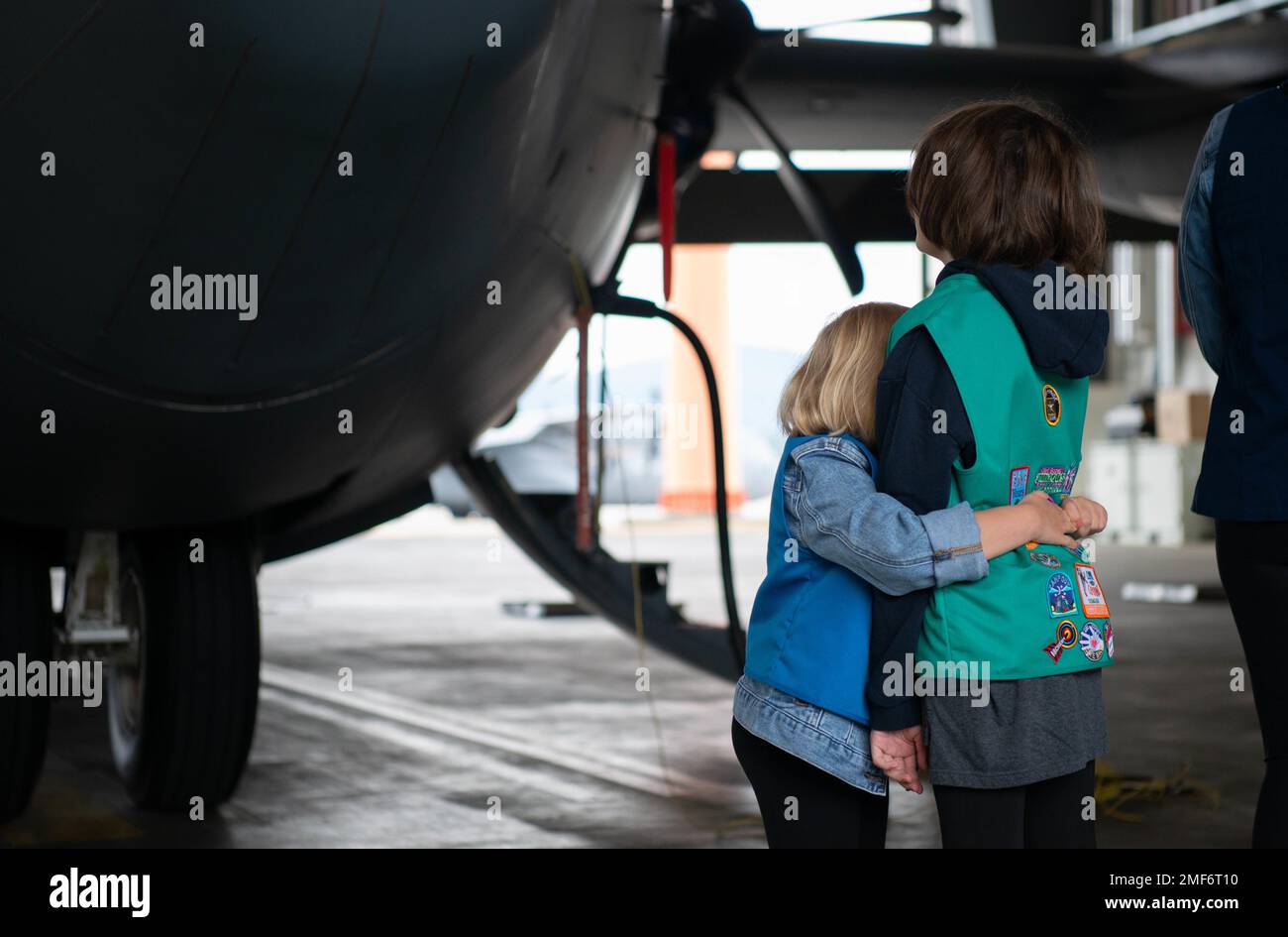 Girl Scouts Ela Edwards, left, and Ava Edwards, right, embrace as they ...