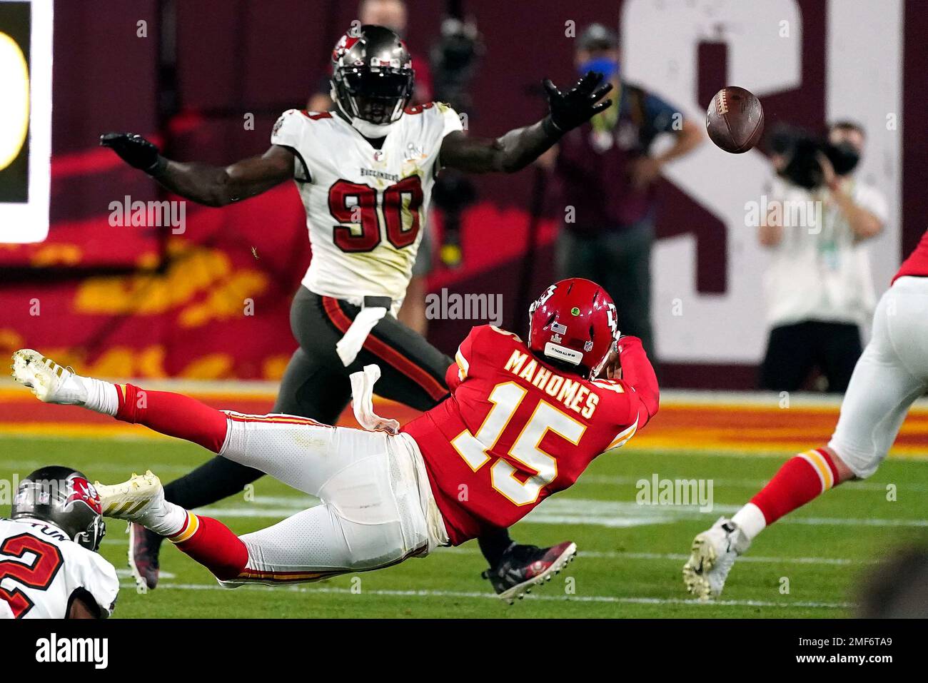 Kansas City Chiefs QB Patrick Mahomes (15) throws a pass while falling ...
