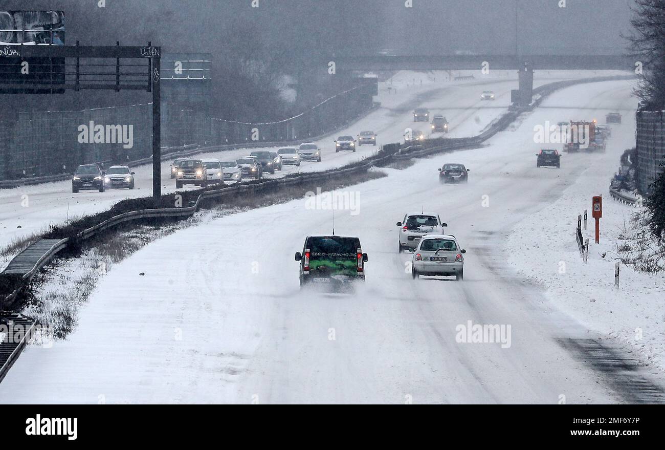 Cars driving carefully on the snowy Autobahn A2 in Gelsenkirchen ...