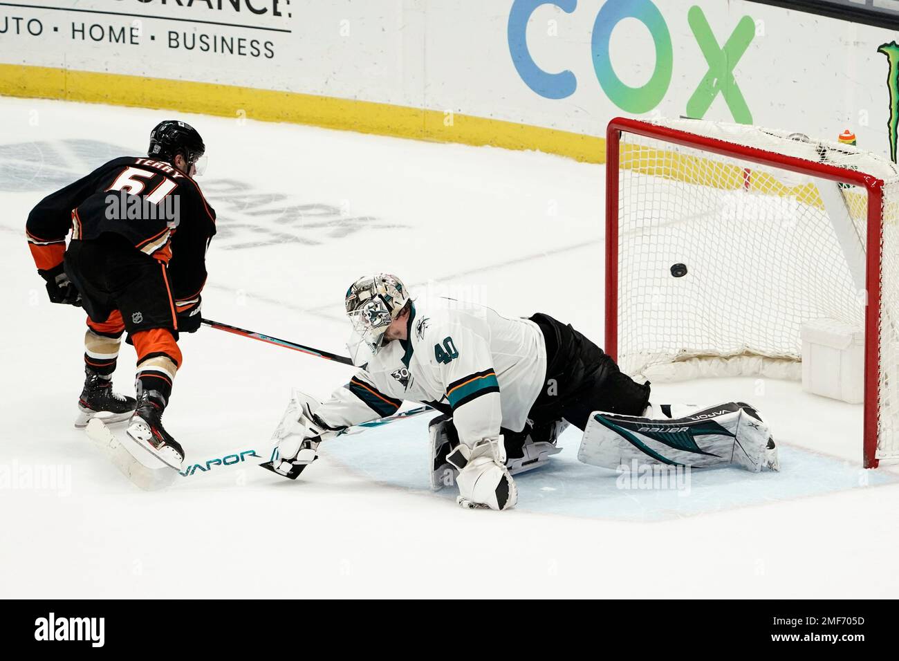 Anaheim Ducks' Troy Terry, left, scores against San Jose Sharks ...