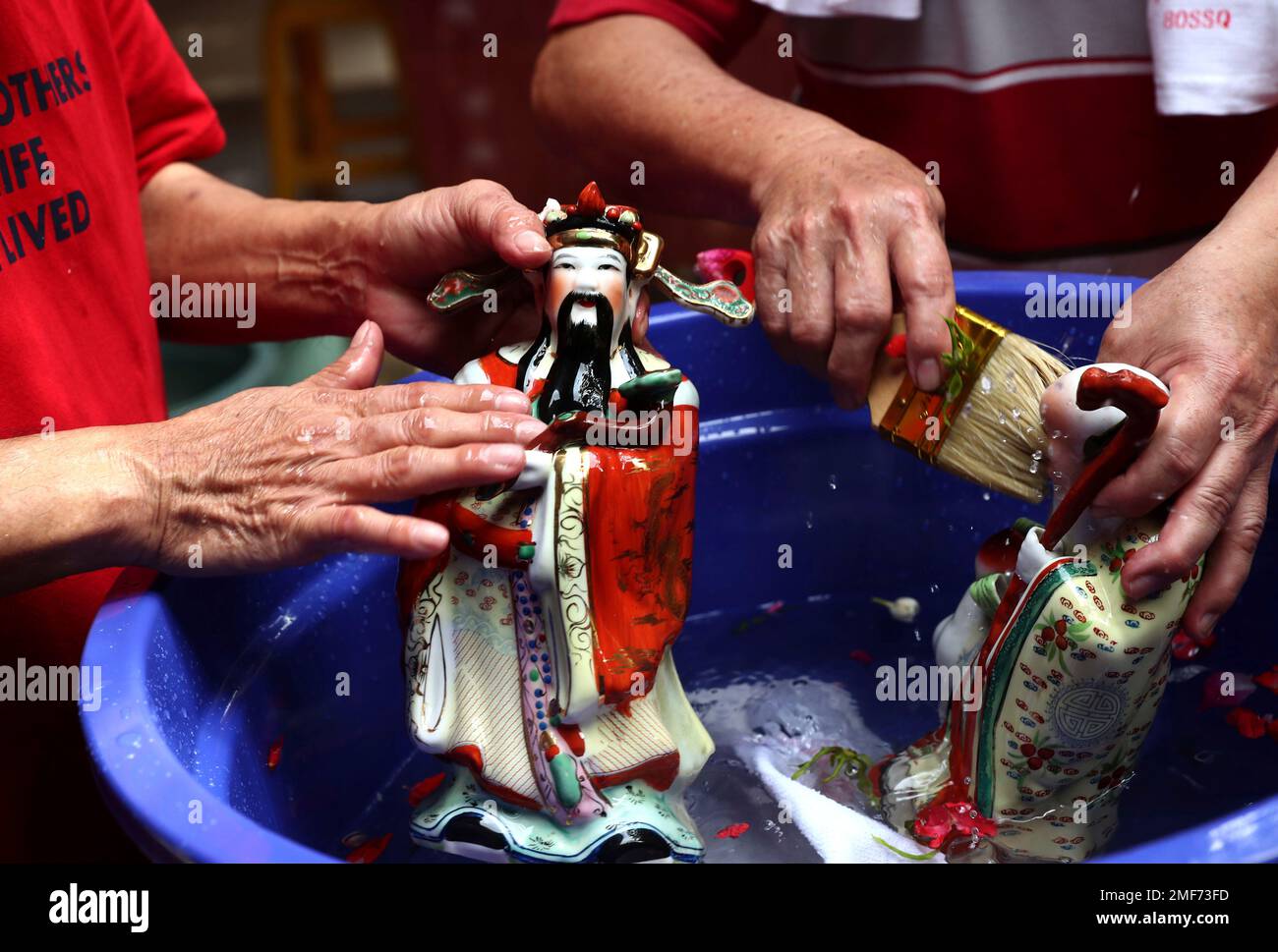 Chinese god statues is cleaned in preparation for the upcoming Lunar ...