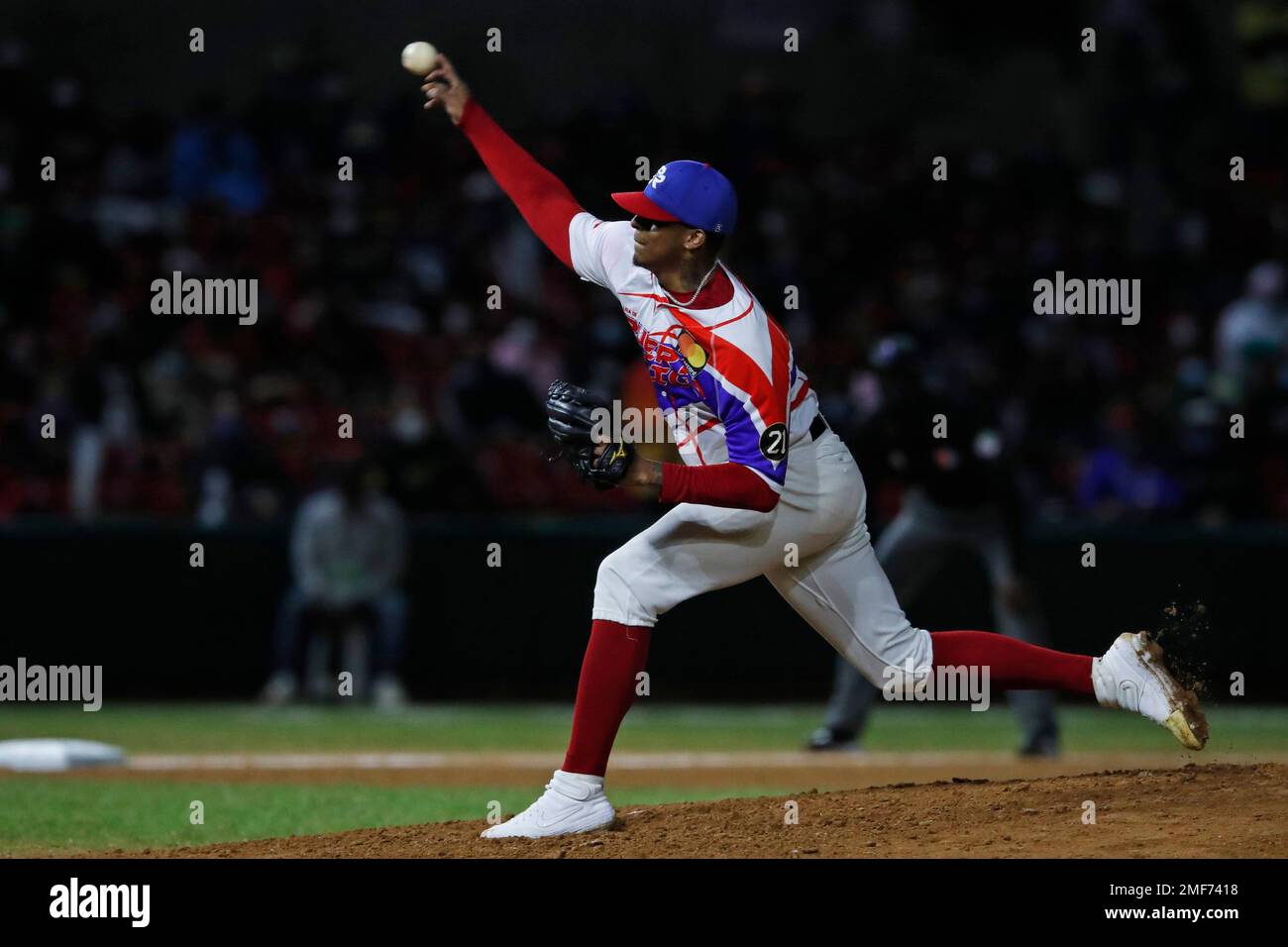 Puerto Rico Starting Pitcher Luis Medina Throws To A Mexico Batter During The First Inning Of A
