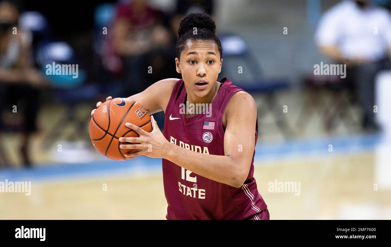 Savannah Wilkinson (12) handles the ball during an NCAA college ...