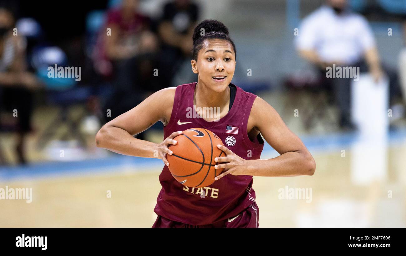 Savannah Wilkinson (12) handles the ball during an NCAA college ...