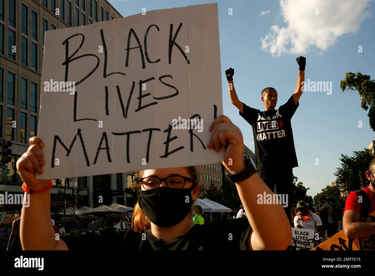 FILE - In this June 24, 2020, file photo, Antonio Mingo, right, holds ...