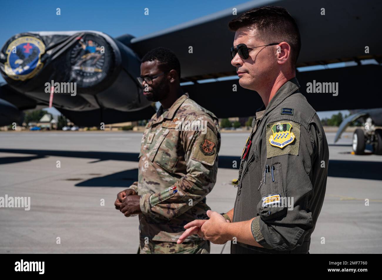 Capt. Tanner Devotie, right, 96th Bomb Squadron aircraft commander, and ...