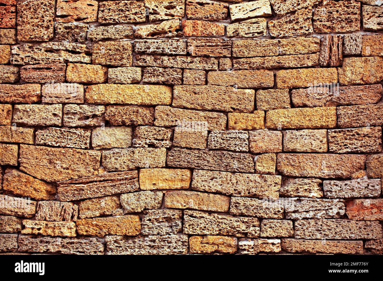 A wall made of natural stone, shell. Use of natural materials in ...