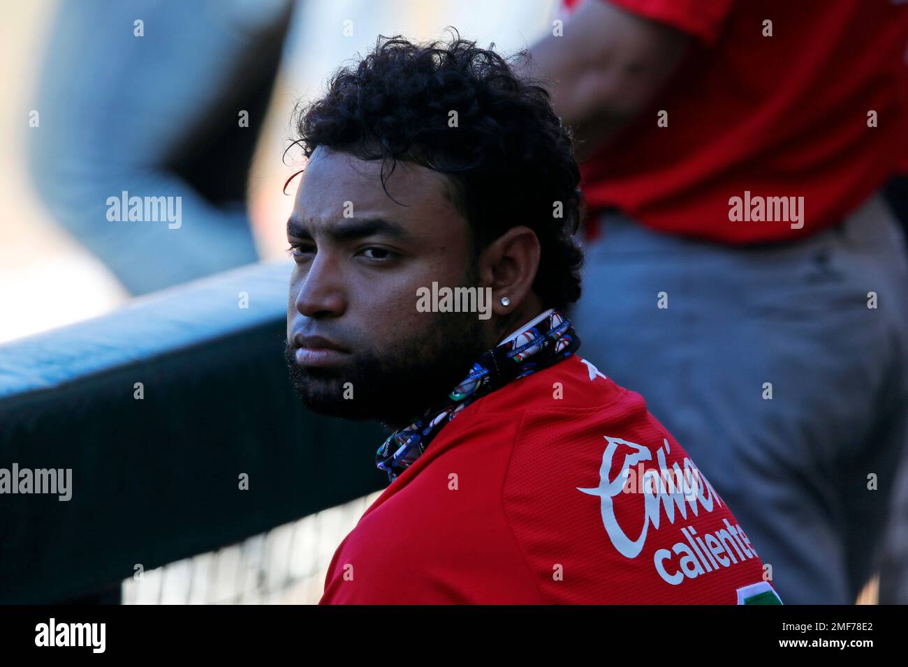 Panama's Jesus Lopez looks away while sitting in the dugout after ...