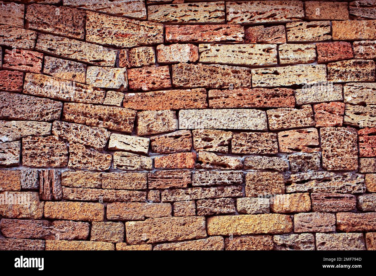 A wall made of natural stone, shell. Use of natural materials in ...