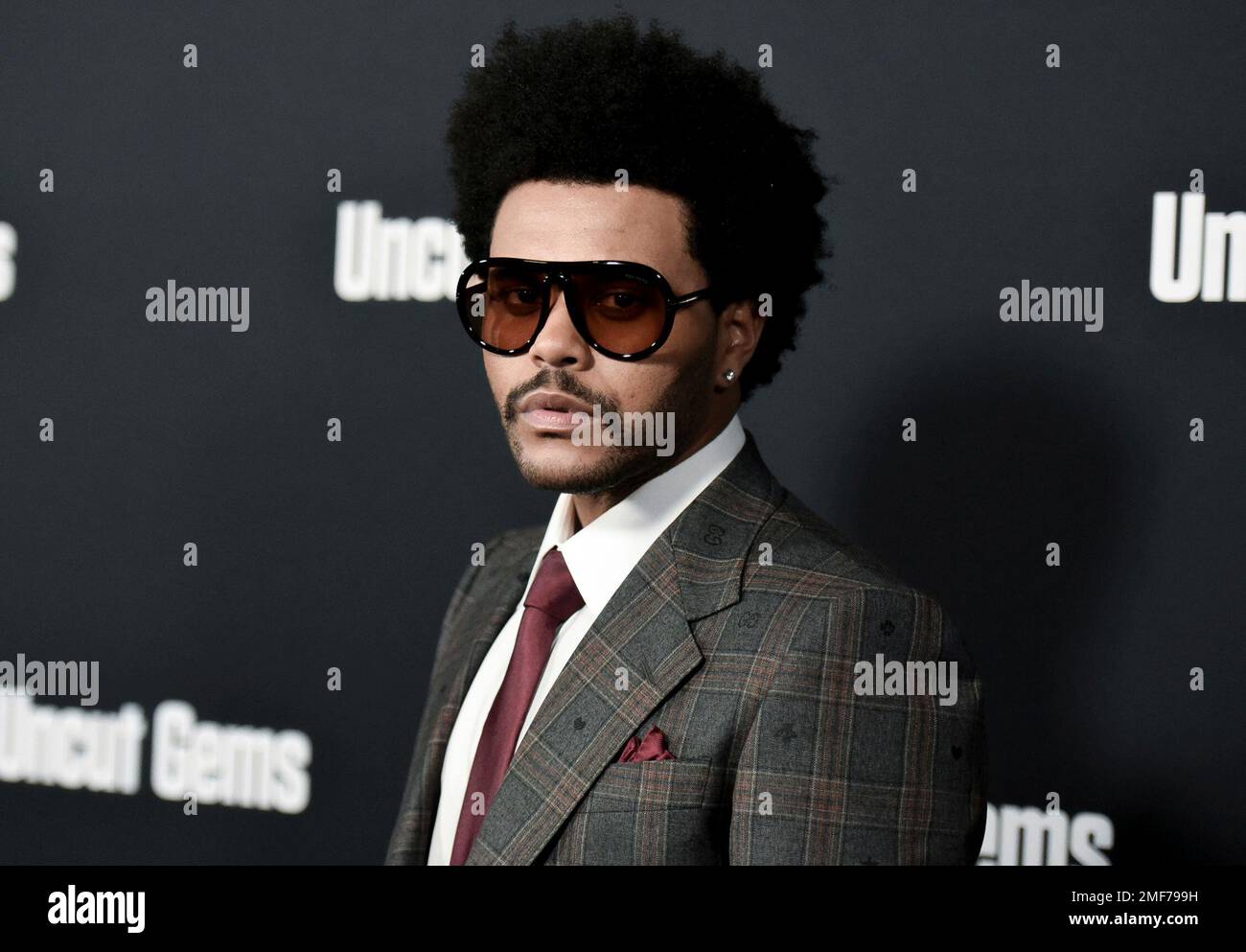 FILE - The Weeknd attends the LA premiere of "Uncut Gems" at ArcLight ...