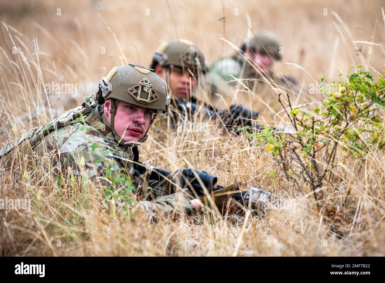 Airmen from the 423d Security Forces Squadron lay prone with their ...