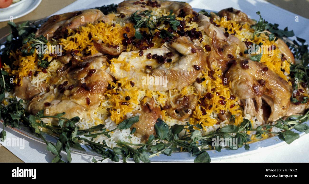 Persian chicken with pomegranate fruit and saffron rice, traditional ...
