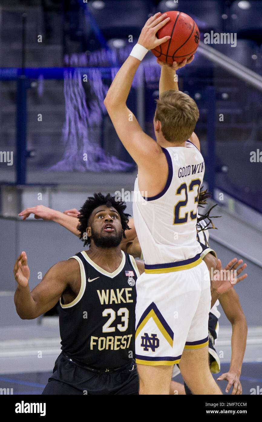 Notre Dame's Dane Goodwin, right, shoots over Wake Forest's Isaiah ...