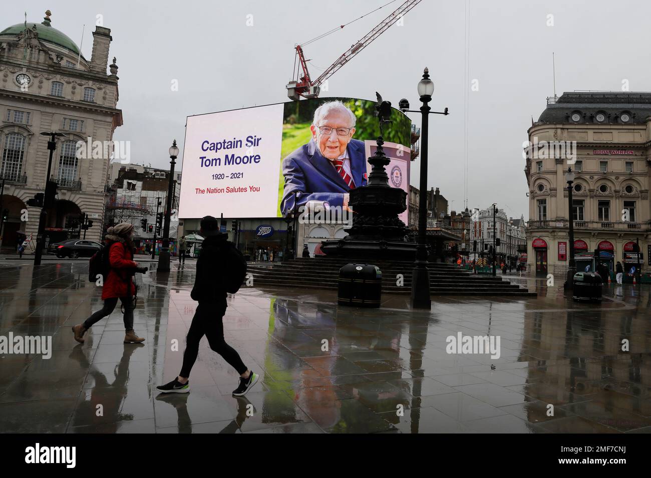 A giant picture of Captain Tom Moore is displayed at Piccadilly Circus ...