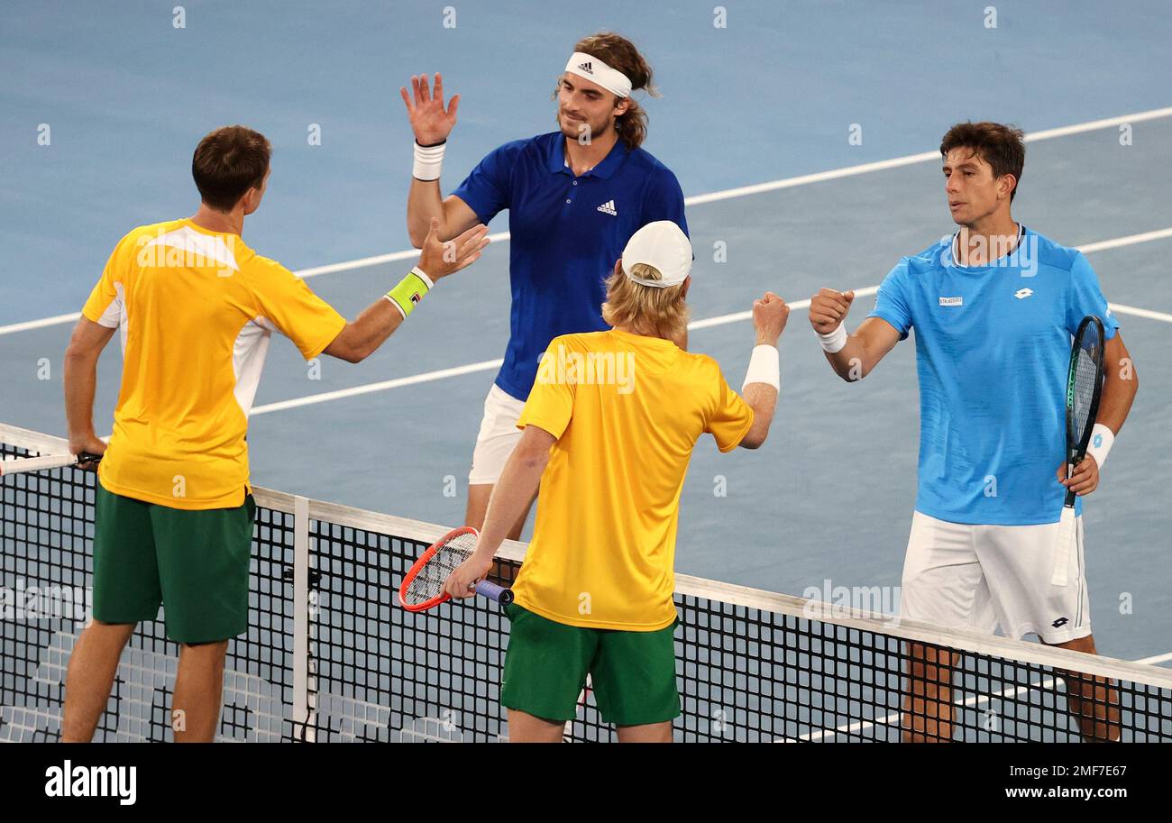 Australia's John Peers, left, and Luke Saville, second right, are ...