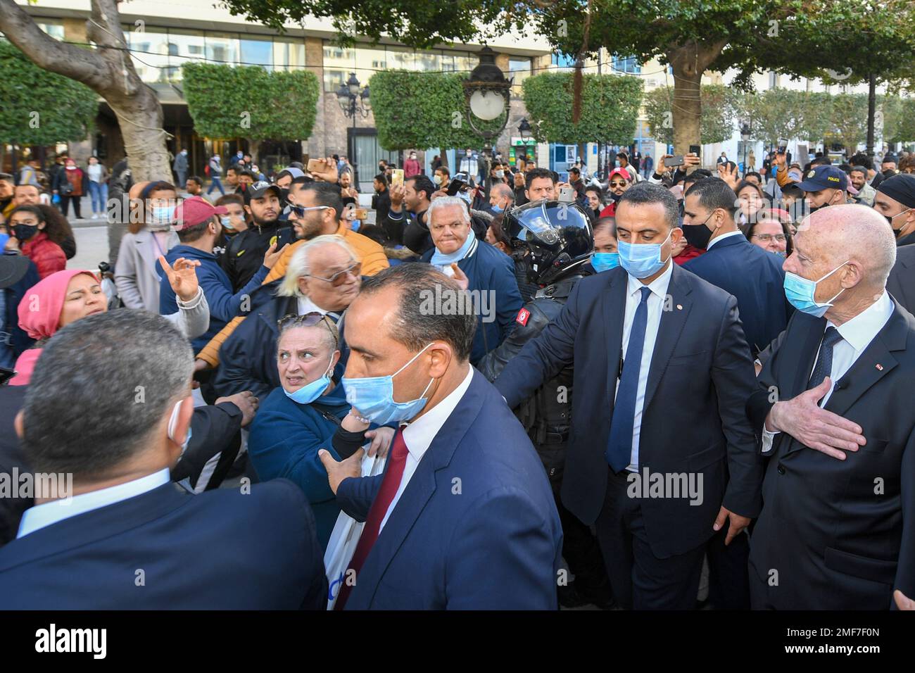 Tunisian President Kais Saied, right, listens to Tunisian citizens as ...