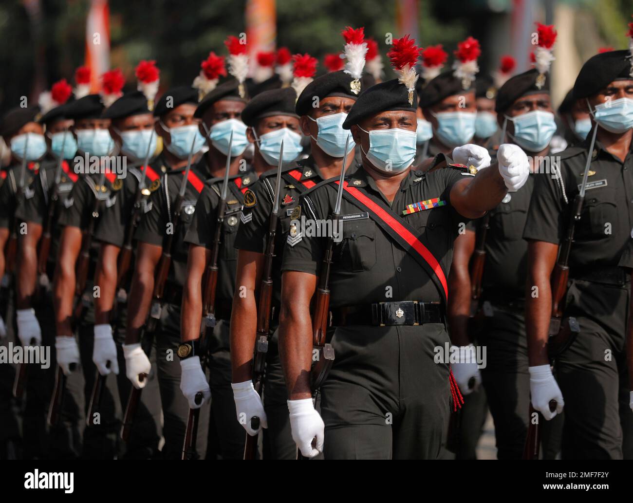 Sri Lankan army soldiers march during the 73rd Independence Day parade ...