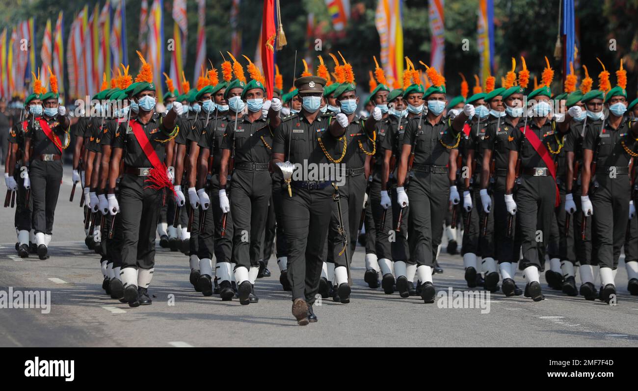 Sri Lankan army soldiers march during the 73rd Independence Day parade ...
