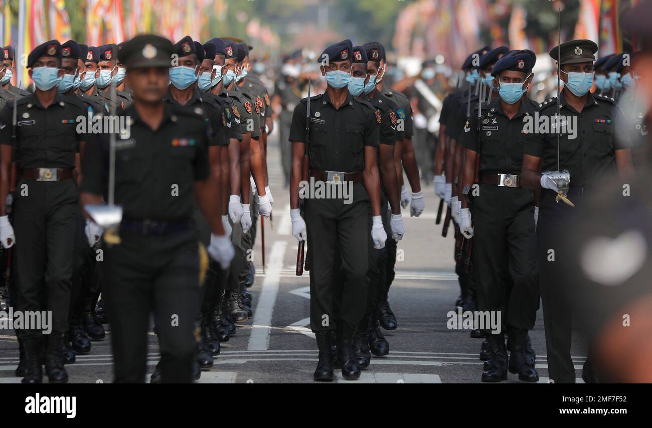 Sri Lankan army soldiers march during the 73rd Independence Day parade ...