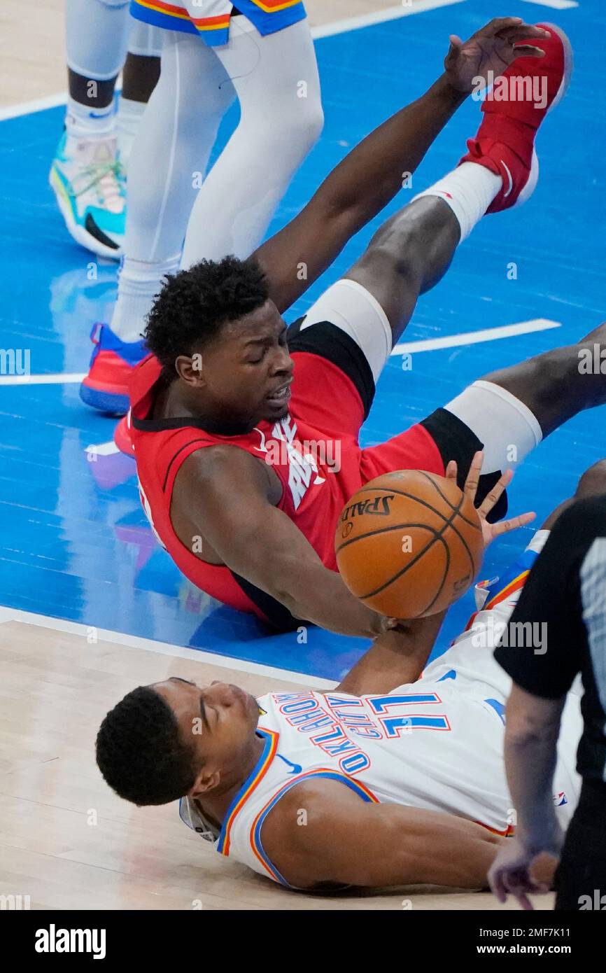 Houston Rockets forward Jae'Sean Tate, top, and Oklahoma City Thunder ...