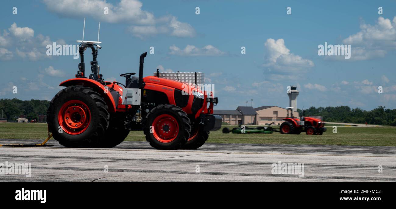 Two autonomous tractors traverse the flight line on Scott Air Force ...