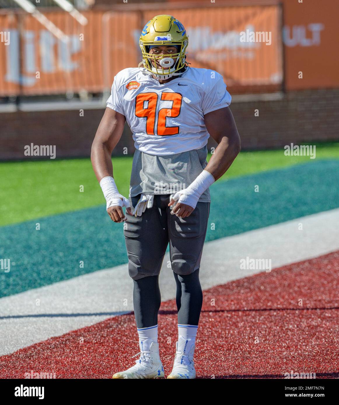 National Team offensive lineman Osa Odighizuwa of UCLA (92) runs a ...