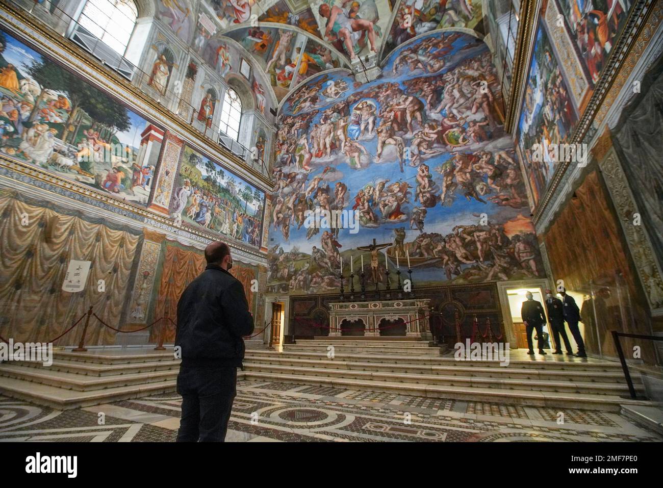 Visitors walk through the Sistine Chapel at the Vatican, Monday, Feb. 1 ...
