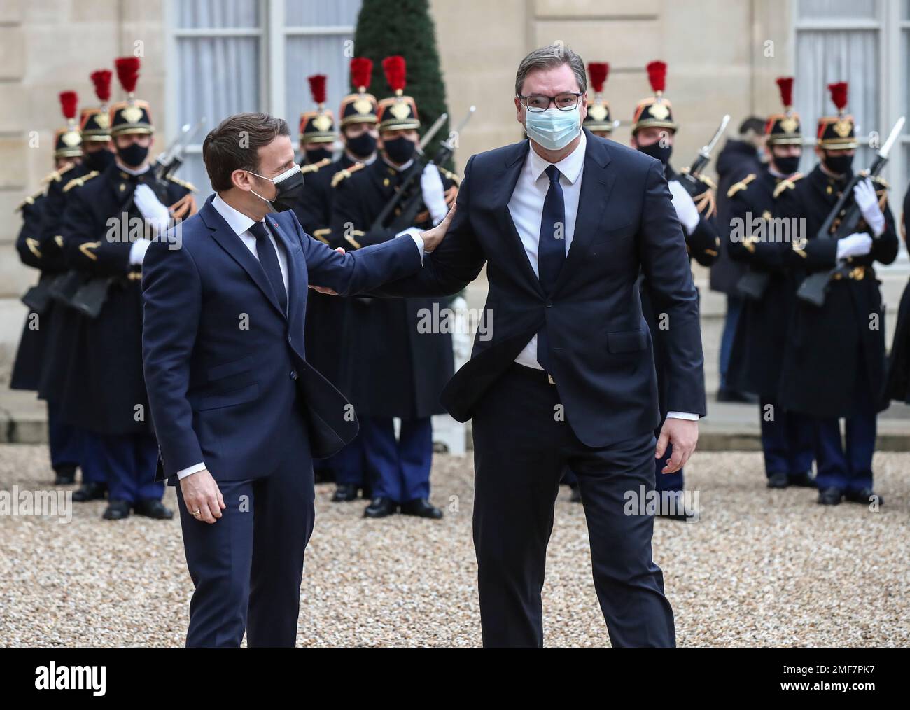 French President Emmanuel Macron, left, welcomes Serbian President ...