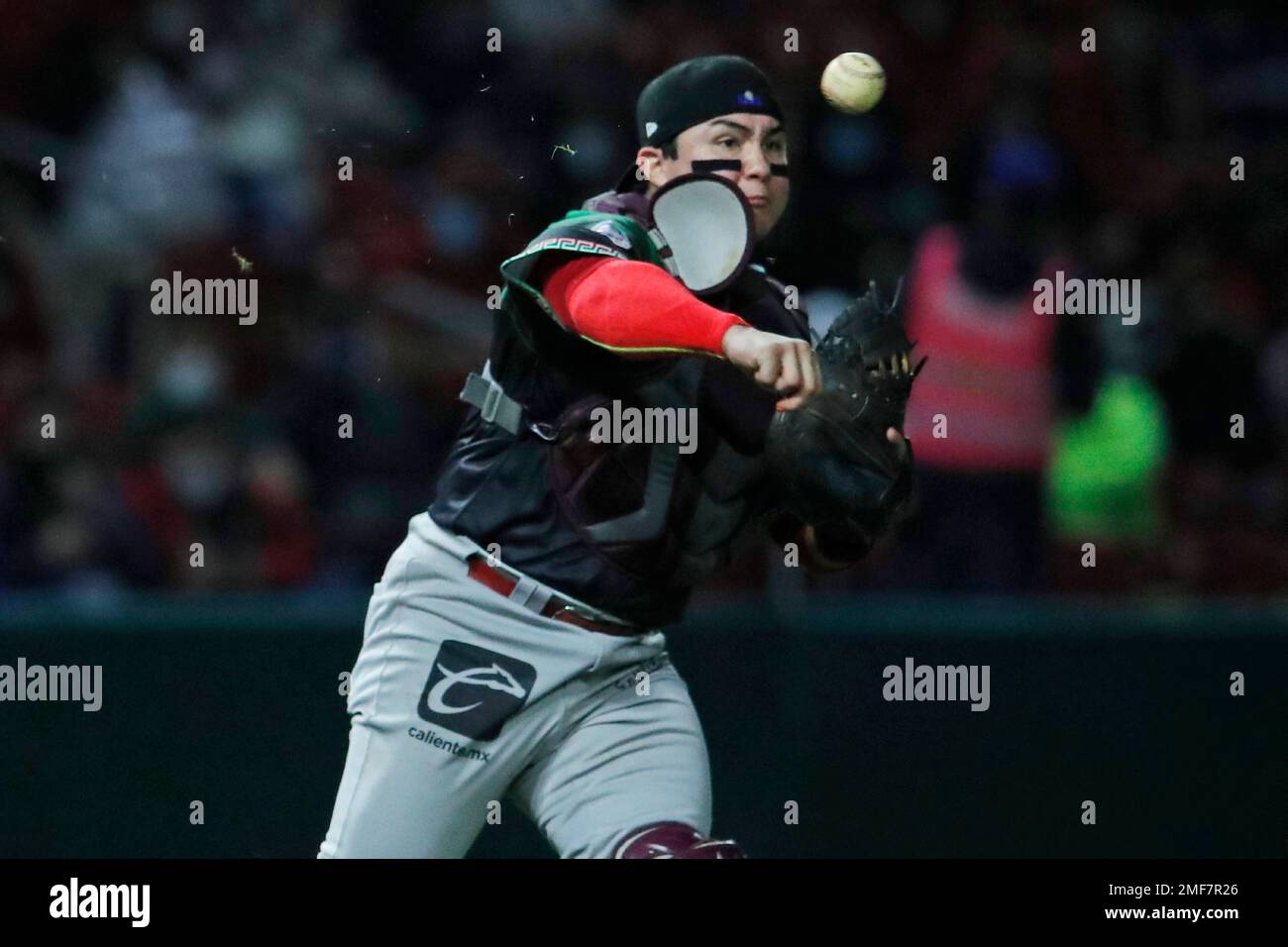 Mexico's Alexis Wilson throws to first base to put out Colombia's ...