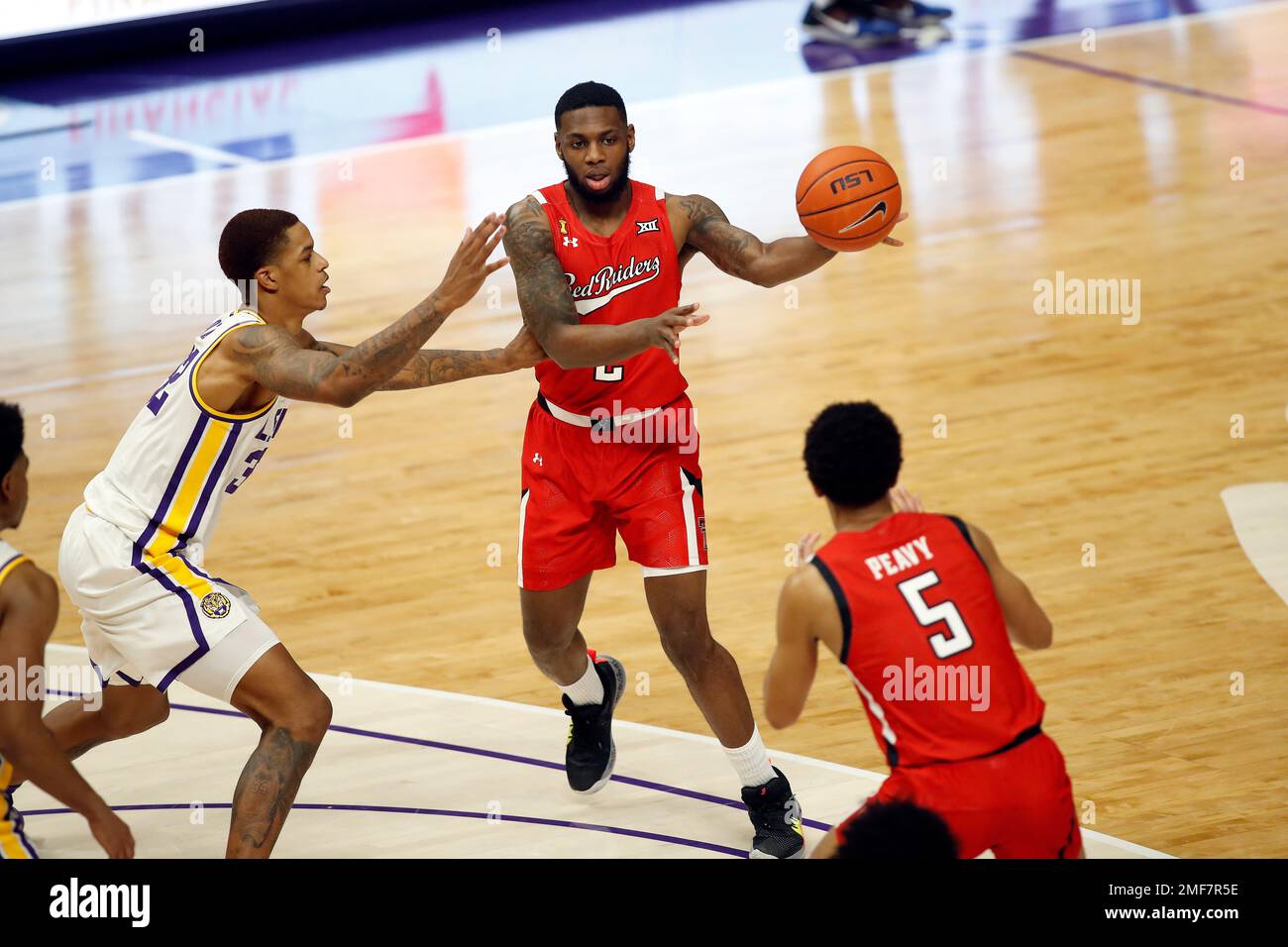 Texas Tech guard Jamarius Burton (2) and LSU forward Shareef O'Neal (32 ...