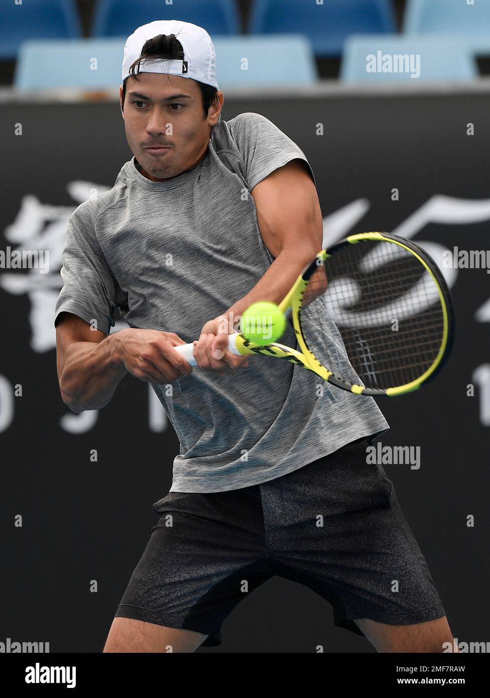 Australia's Jason Kubler makes a backhand return to Italy's Lorenzo ...