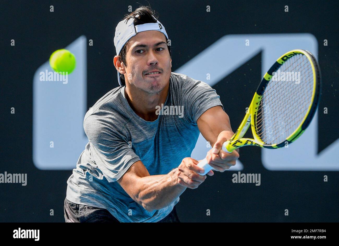 Australia's Jason Kubler makes a backhand return to Italy's Lorenzo ...