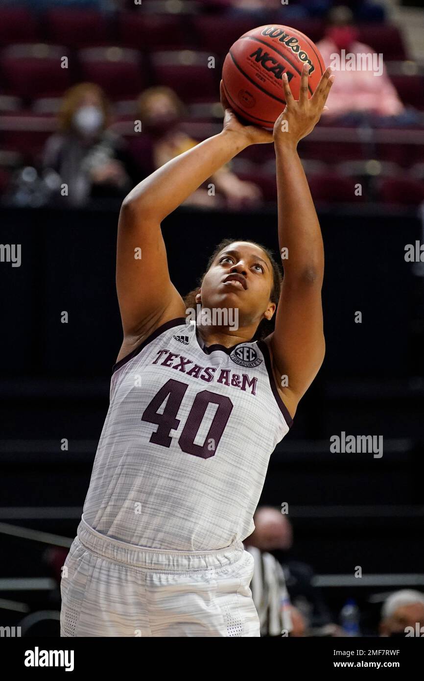 Texas A&M center Ciera Johnson (40) shoots the ball against Georgia ...