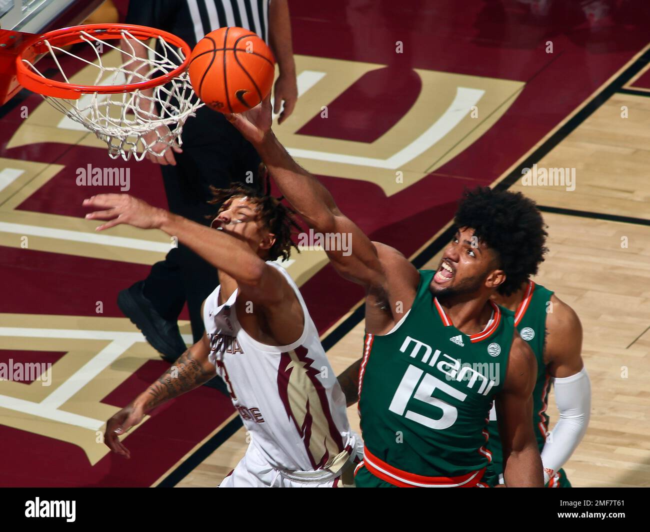 Miami forward Norchad Omier (15) gets a rebound over Florida State ...