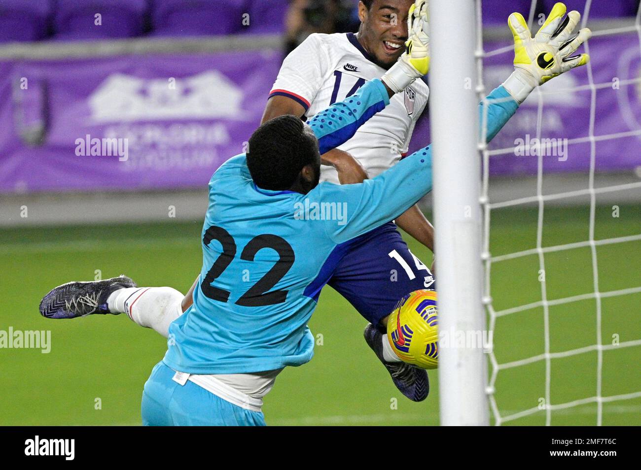 Trinidad and Tobago goalkeeper Adrian Foncette (22) blocks a header by ...