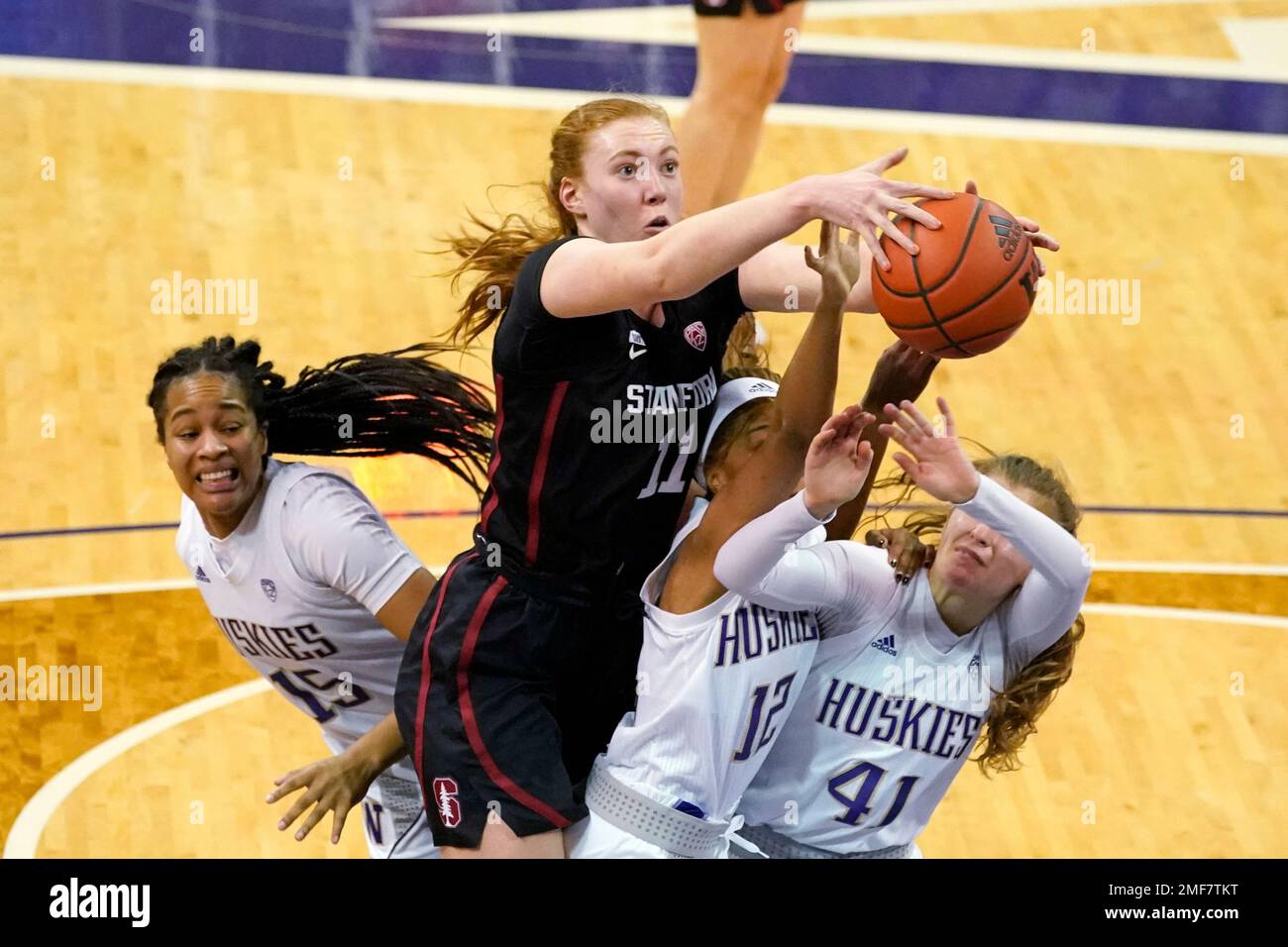 Stanford's Ashten Prechtel (11) reaches for a rebound over Washington's ...