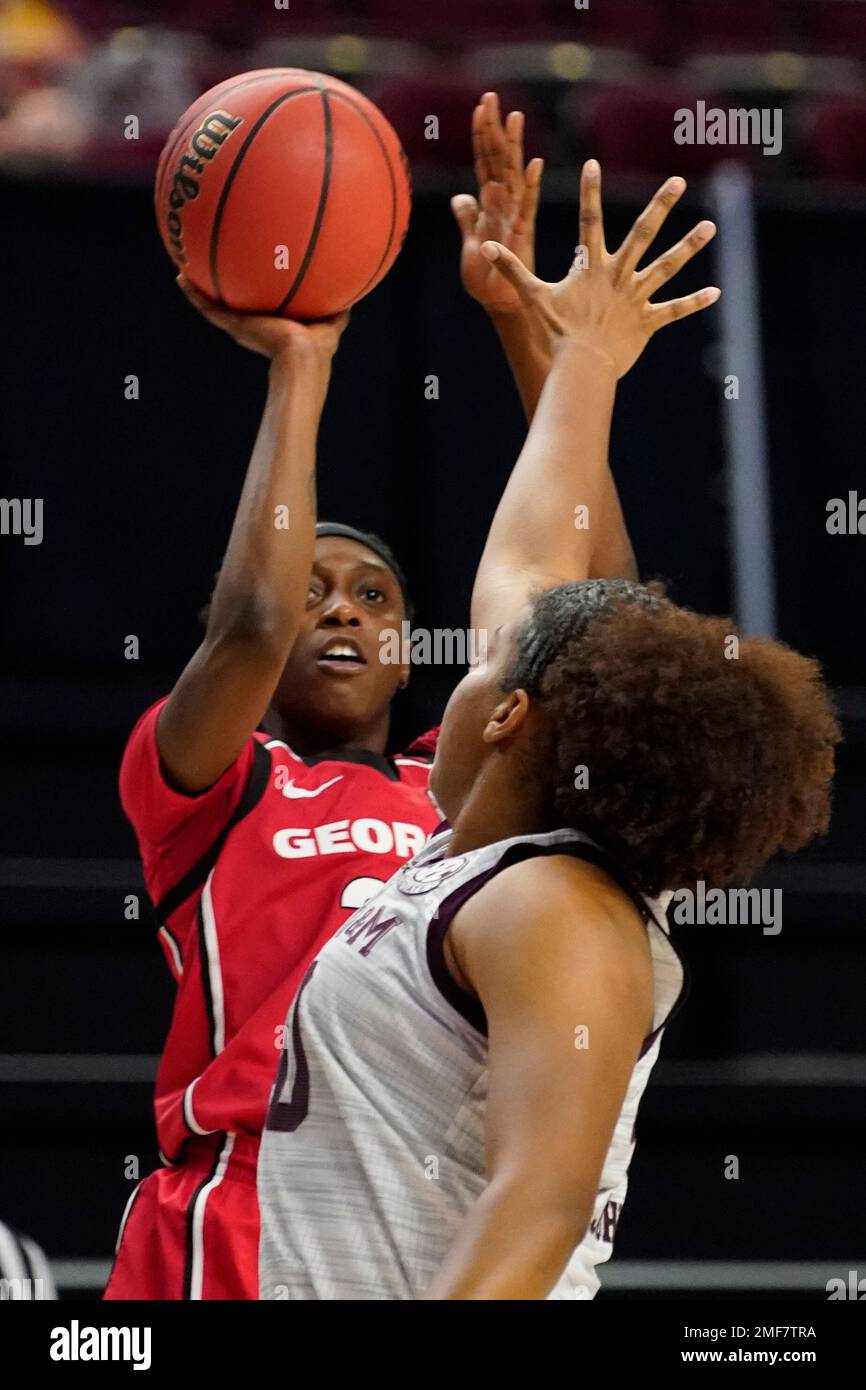 Georgia guard Que Morrison (23) makes a basket over Texas A&M center ...