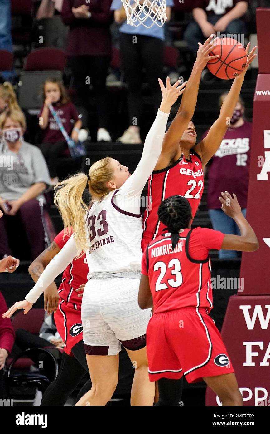 Georgia forward Malury Bates (22) grabs a rebound as she is guarded by ...