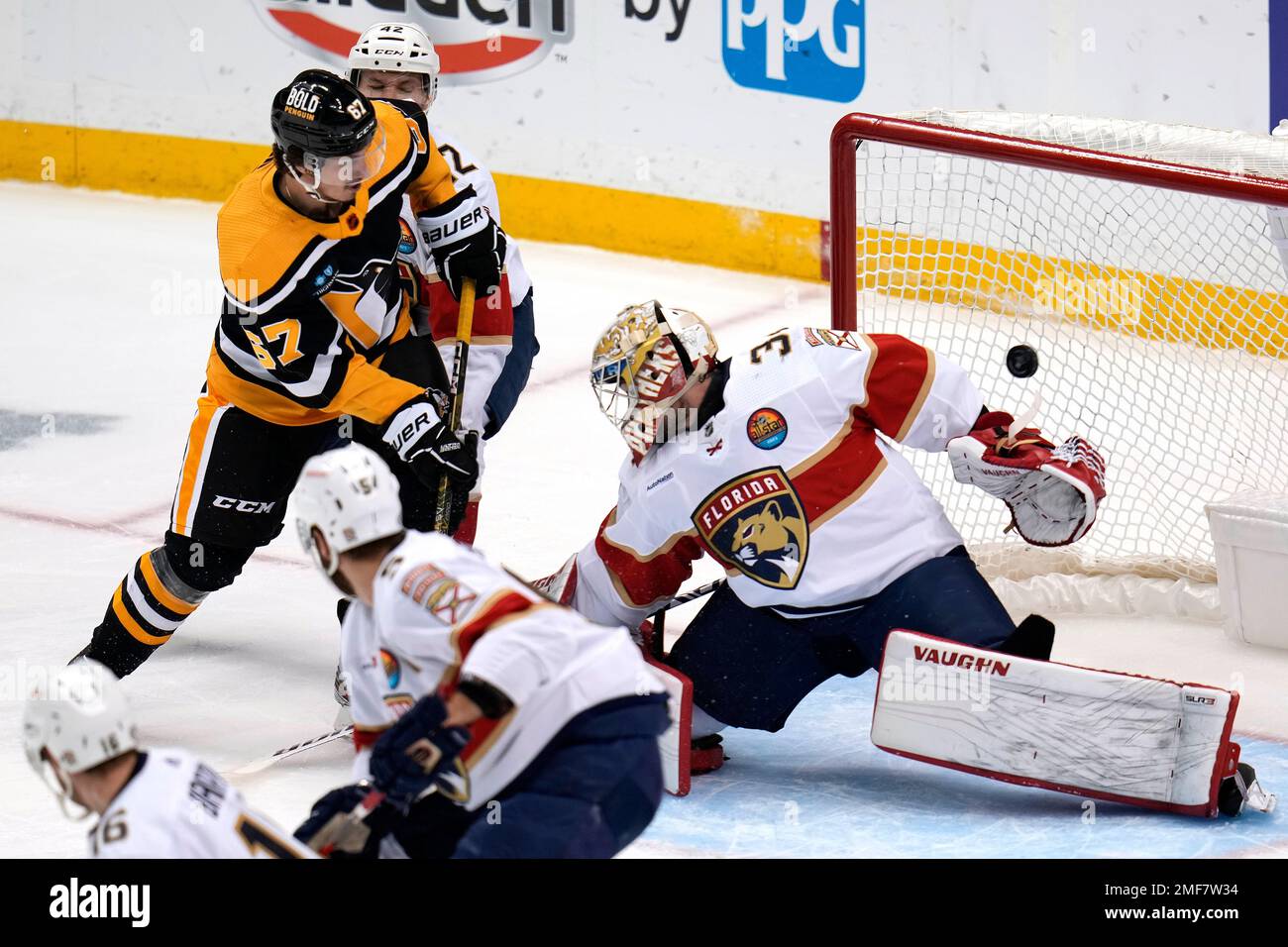 Pittsburgh Penguins' Rickard Rakell (67) puts a rebound behind Florida ...
