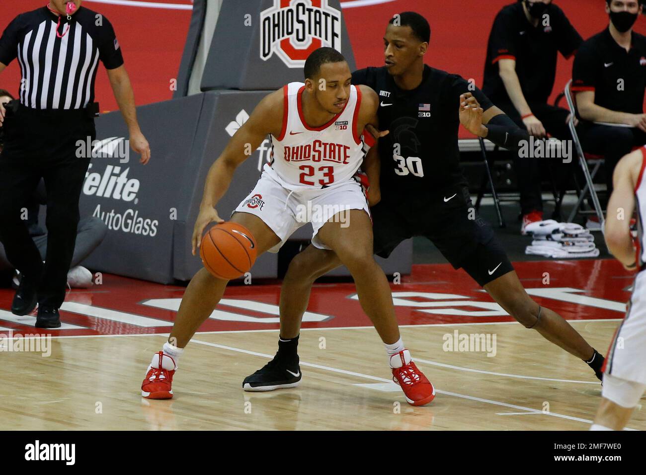 Ohio State's Zed Key, left, posts up against Michigan State's Marcus ...