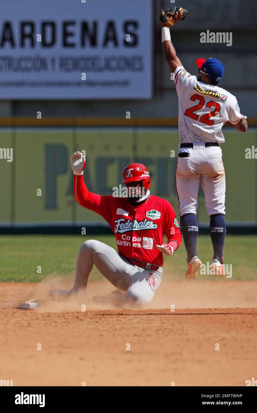 Panama's Jonathan Arauz safely steals second as Venezuela's Ali ...