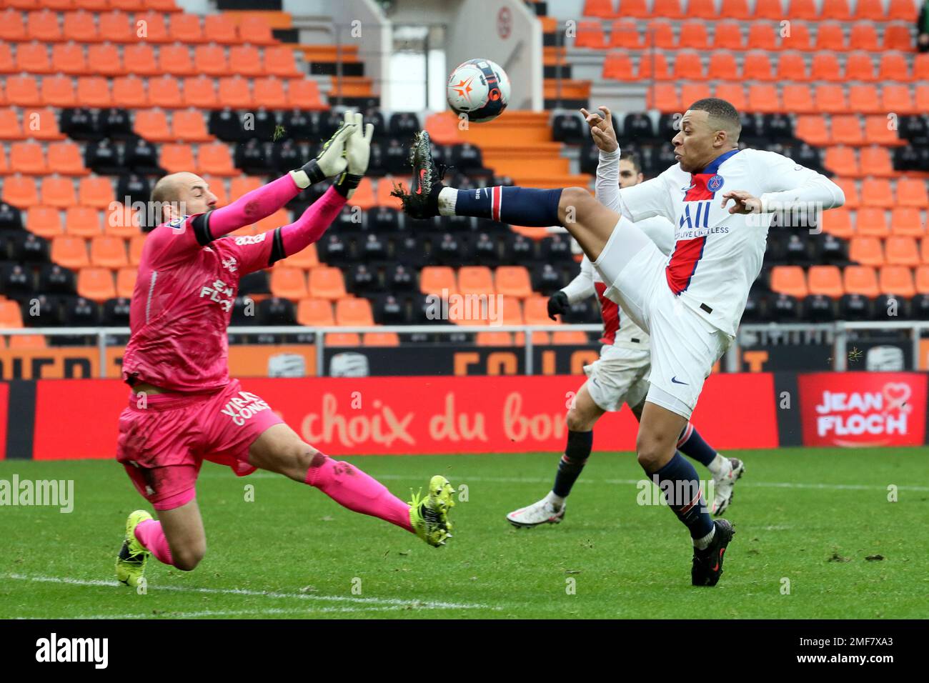 PSG's Kylian Mbappe, right, challenges for the ball with Lorient's ...