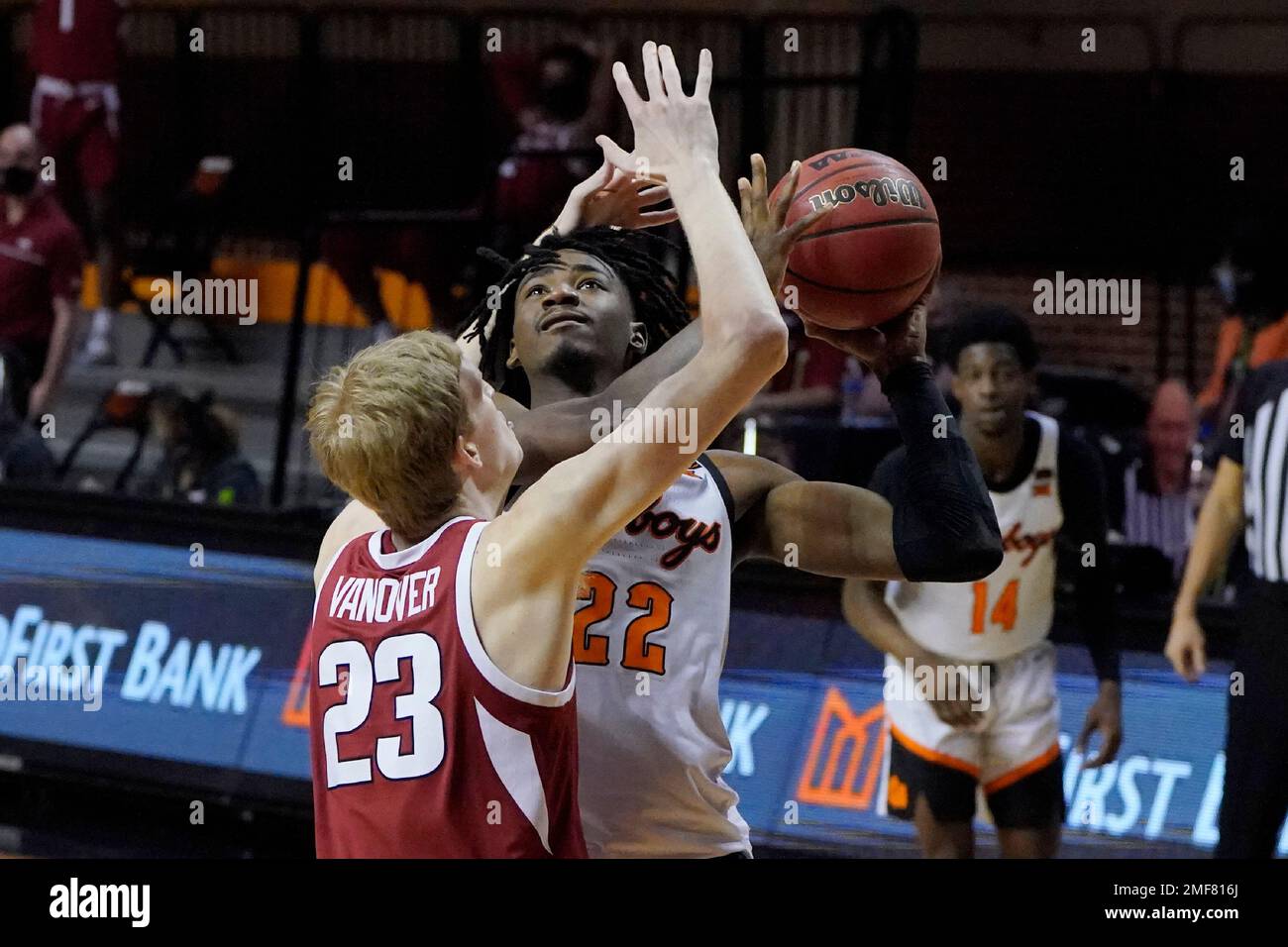 Oklahoma State forward Kalib Boone (22) shoots as Arkansas forward ...