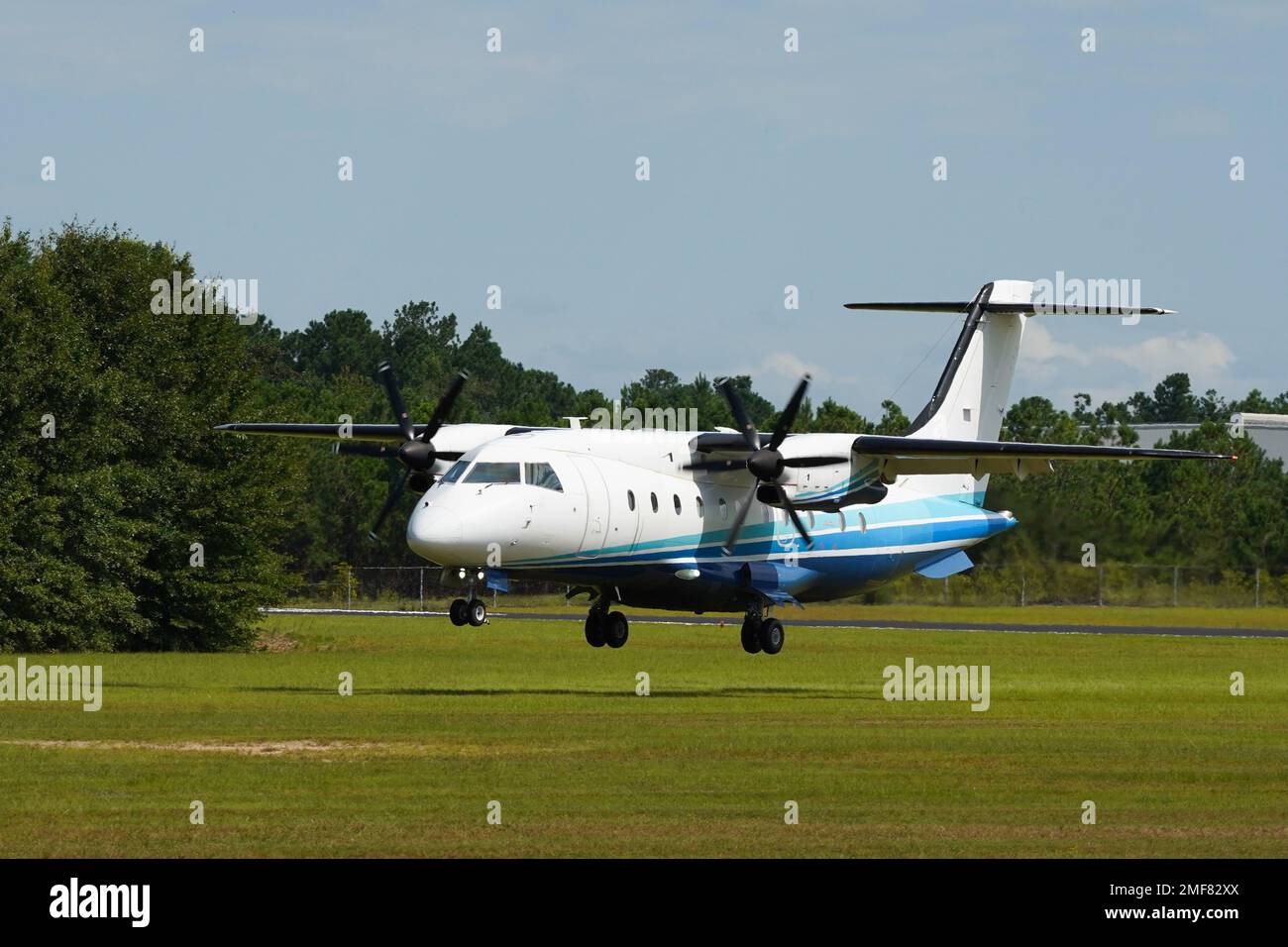 A C-146A Wolfhound from the 524th Special Operations Squadron, touches ...