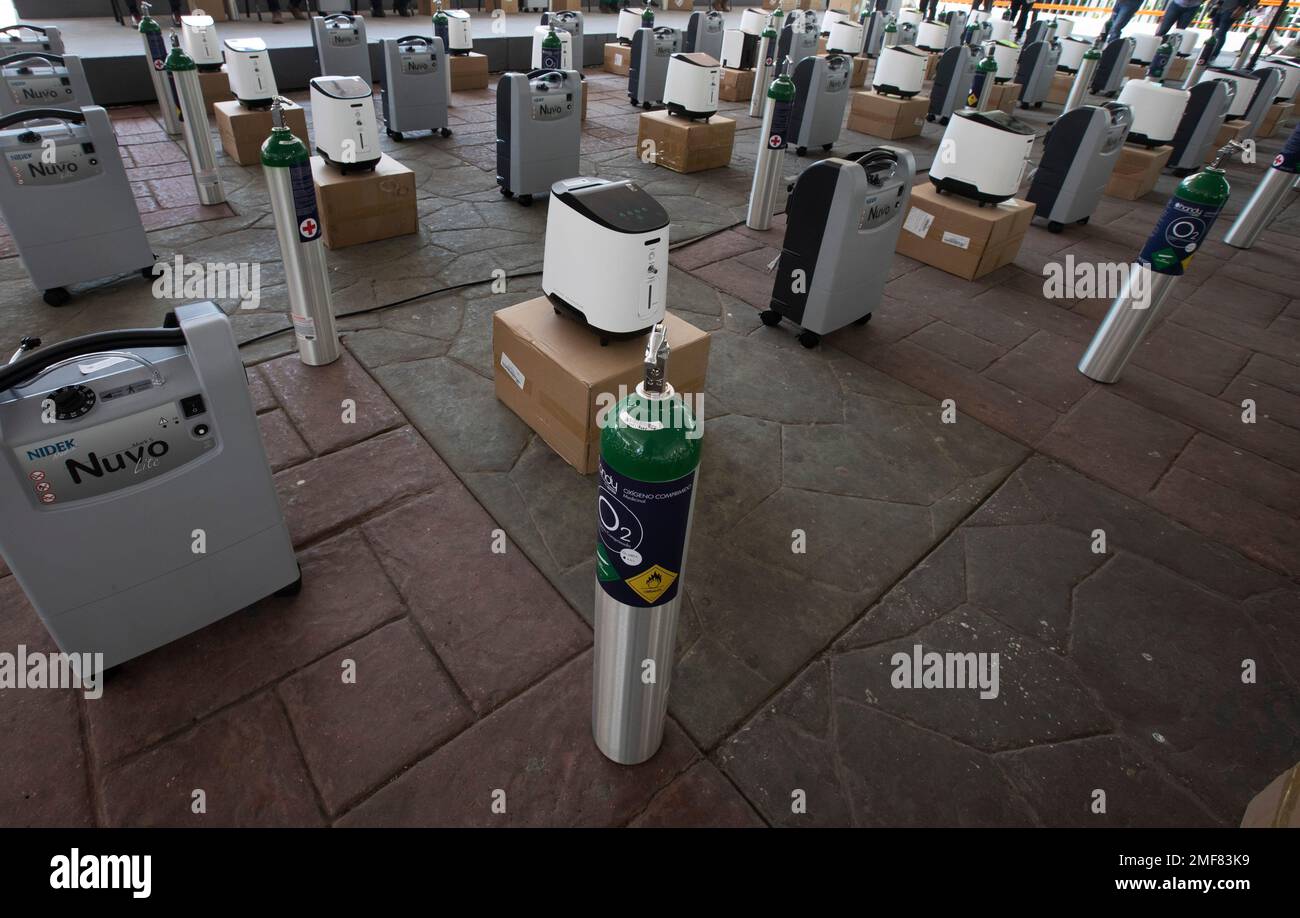 Rows of oxygen concentrators for COVID-19 patients sit in the main ...